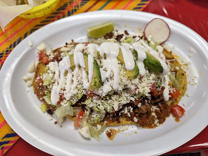 A huarache so loaded with toppings it requires engineering skills to eat. Worth every napkin you'll need afterward.