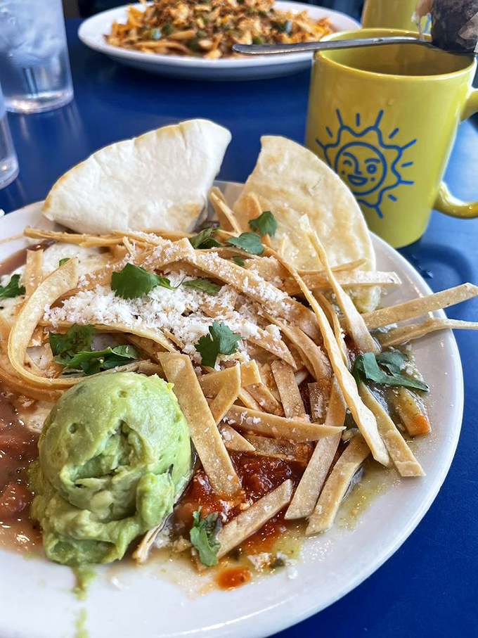 Tortilla strips standing tall like a crown atop this huevos rancheros&mdash;the breakfast royalty of the Southwest with avocado as the perfect sidekick.