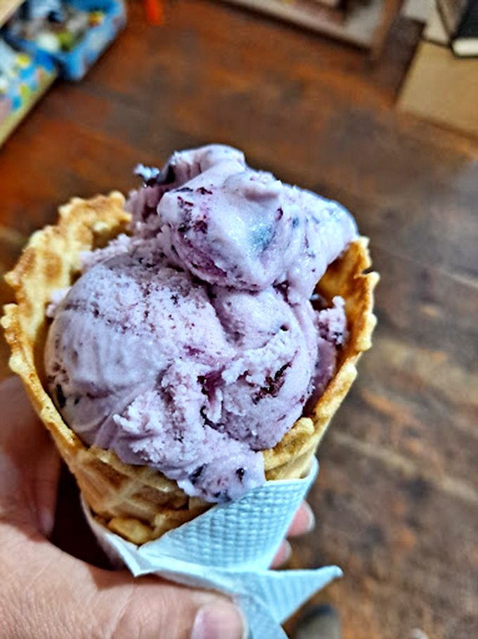 Huckleberry ice cream in a waffle cone&mdash;nature's purple gold mined from mountain slopes and transformed into creamy, cold treasure.