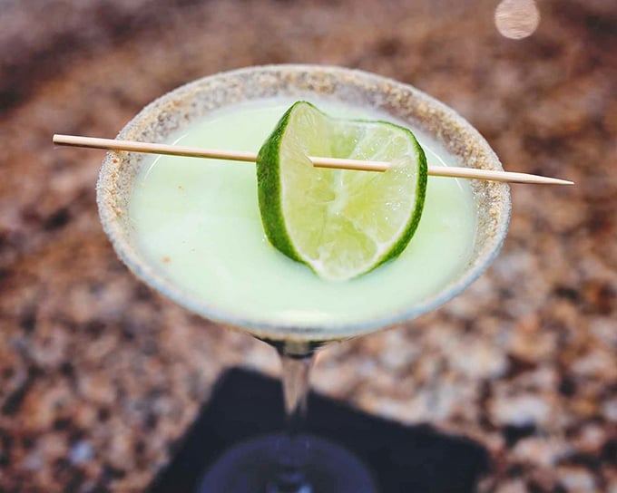 Not your average cocktail&mdash;this Key Lime Pie martini delivers dessert in liquid form, with that lime wedge standing at attention like a tiny citrus soldier.