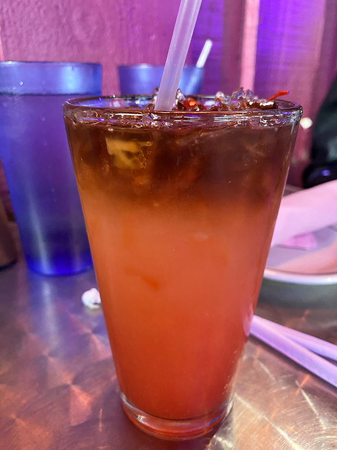 The Mai Tai glows with tropical promise. This isn't just a drink; it's a vacation in a glass waiting to transport you.