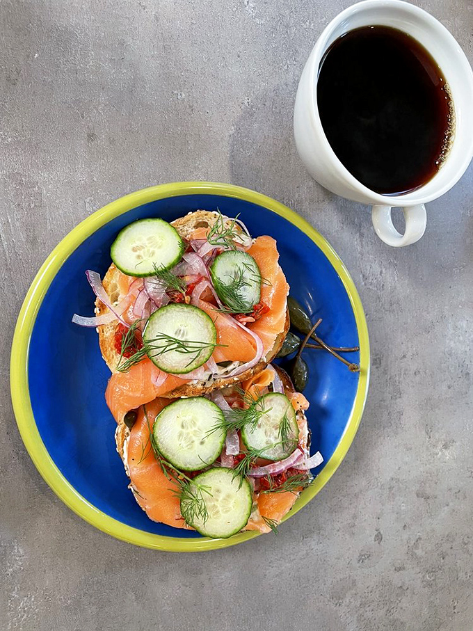 Lox and bialy – the breakfast of champions. Silky salmon, crisp cucumber, and bright dill creating a perfect harmony on each bite.