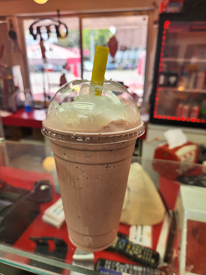 Their milkshakes bring all discerning dessert enthusiasts to the yard, with that perfect consistency that requires just enough straw effort to feel earned.