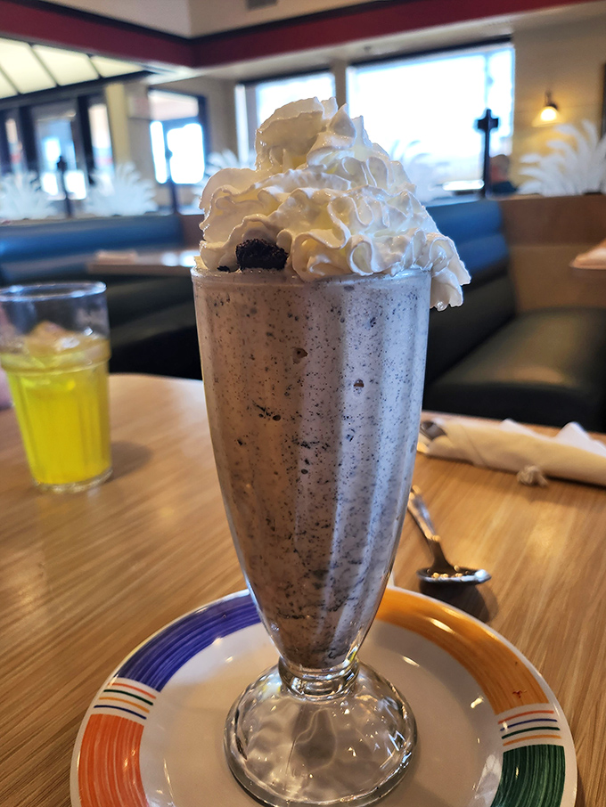 This isn't just a milkshake; it's a tower of creamy indulgence that makes you wonder why anyone bothers with fancy desserts.