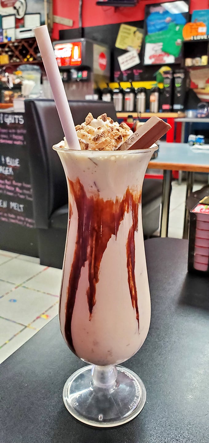 Not all milkshakes bring the boys to the yard, but this chocolate masterpiece definitely would. It's practically wearing a tuxedo of whipped cream and candy.