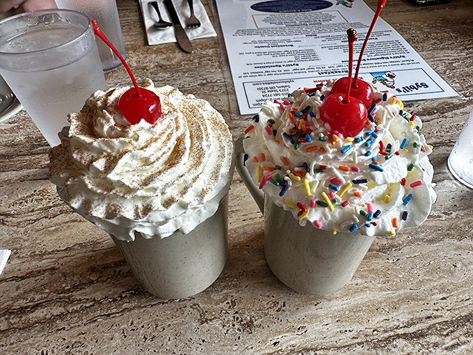 Milkshakes topped with enough whipped cream to qualify as their own food group. The cherry on top isn't just an expression here.