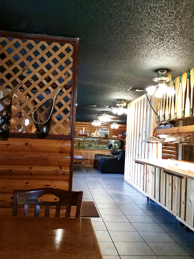 Wooden dividers and lattice work create dining nooks that feel private yet connected, like the perfect small-town diner should.