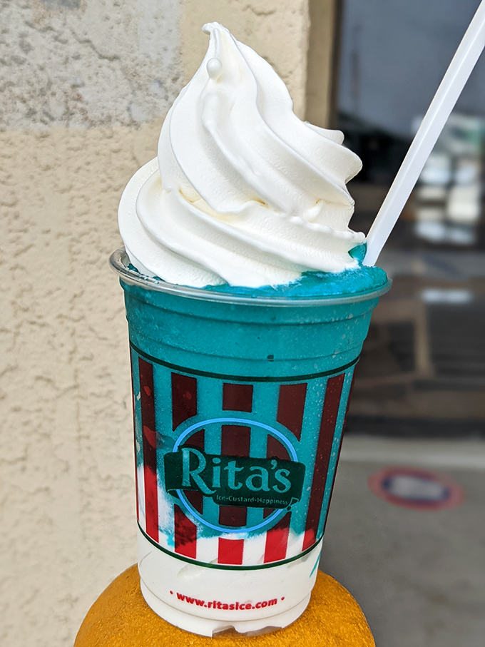 Blue Italian ice crowned with vanilla custard &ndash; like diving into a refreshing ocean and emerging into a creamy cloud.