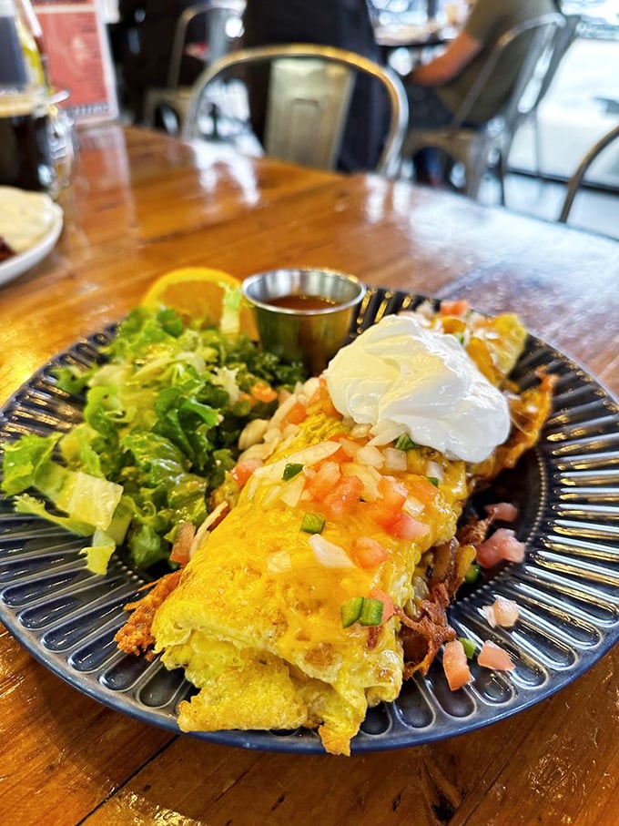 This omelet isn't messing around. Topped with fresh salsa and sour cream, it's the breakfast equivalent of wearing a tuxedo to a pool party.
