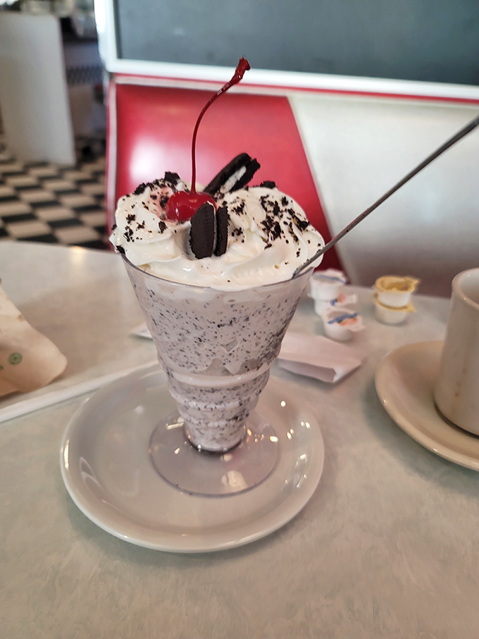 Not so much a milkshake as a work of art&mdash;cookies, cream, whipped topping, and that cherry on top saying "You deserve this."