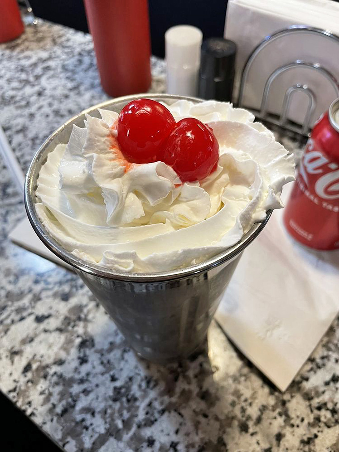 Dessert or work of art? This Oreo milkshake topped with whipped cream and cherries is the sweet finale every burger deserves.