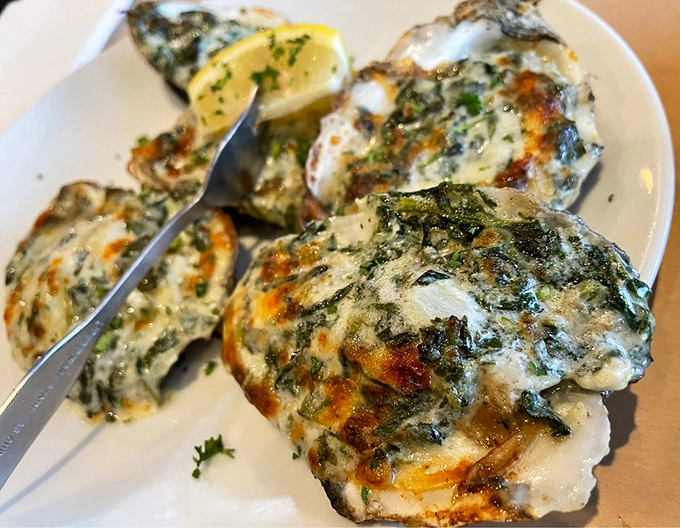 Oysters Rockefeller so decadently topped, they're basically wearing evening gowns to the seafood ball.