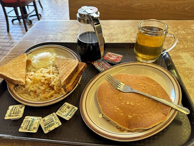 Breakfast of champions: fluffy pancakes, perfect hash browns, and hot coffee &ndash; the holy trinity of morning happiness at Frontier.
