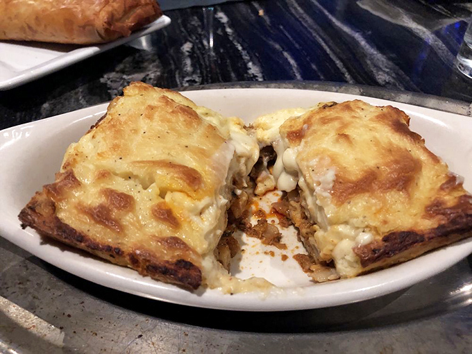 Golden-topped pastitsio, the Greek answer to lasagna, offers layers of comfort that would make even your grandmother nod in approval.
