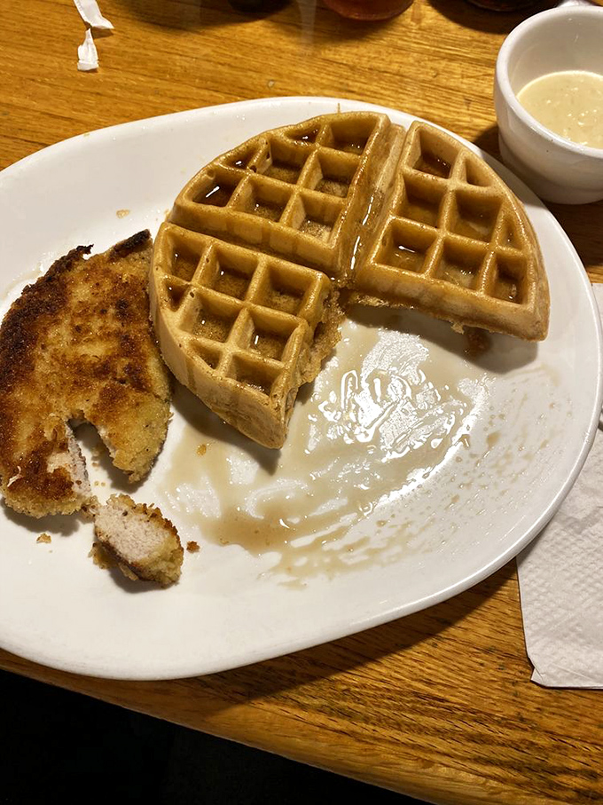 Golden waffle perfection meets crispy fried chicken&mdash;breakfast's power couple that never disappoints. The syrup waiting in the wings is about to make this relationship even sweeter.