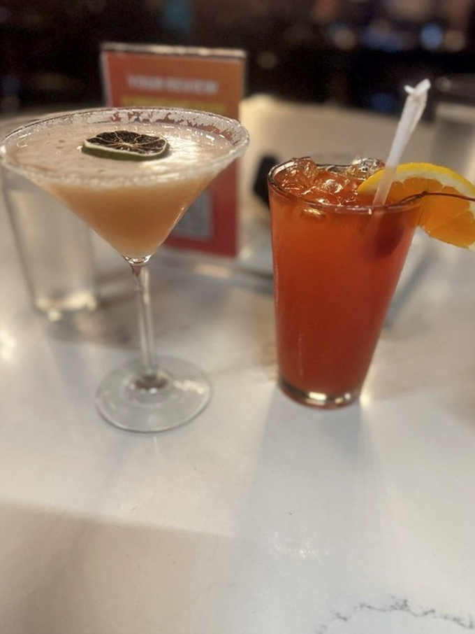 Cocktail artistry in full display. The Phyrita and Rum Punch aren't just drinks&mdash;they're liquid vacations that complement the robust flavors of your meal.