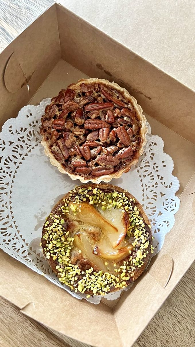 The pear pistachio tart proves that opposites attract deliciously. Those green nuts aren't just decoration&mdash;they're little flavor bombs. 