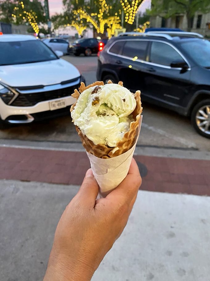 Taking ice cream for a twilight stroll around Denton Square&mdash;the perfect Texas evening companion against a backdrop of twinkling lights.
