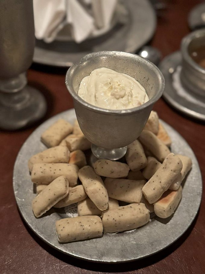 These breadsticks surrounding creamy dip create the edible equivalent of a medieval fortress. The moat is made of flavor.