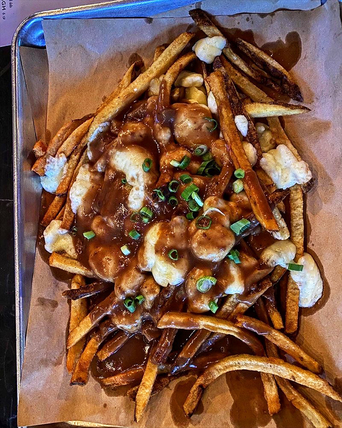 Poutine: where French fries meet gravy, cheese curds, and a higher purpose. Comfort food that hugs you from the inside out.