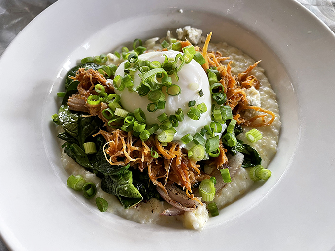 A bowl of comfort where pulled pork meets perfectly poached egg. The kind of breakfast that makes you want to hug the chef.