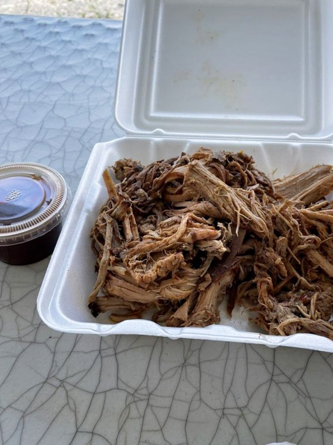 Pulled pork so tender it practically pulled itself. That vinegar sauce standing by is about to elevate this meat to legendary status.