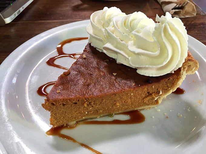 Pumpkin pie with whipped cream waves isn't just seasonal dessert&mdash;it's comfort in circular form, delivering childhood memories with each forkful.