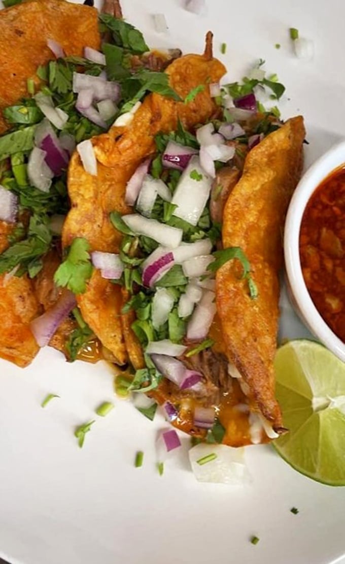 Crispy-edged, cheese-crusted quesobirria tacos that demand to be dipped in that rich, aromatic consomm&eacute;. Worth every napkin.