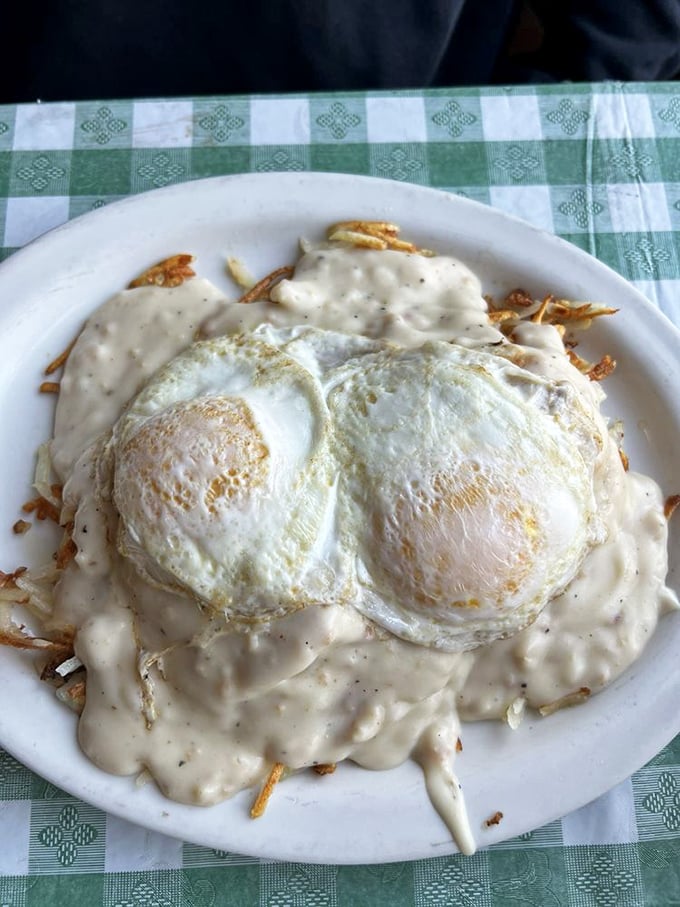 Eggs and hash browns swimming in country gravy&mdash;a breakfast so comforting it's like wearing your favorite sweatpants at a five-star resort.