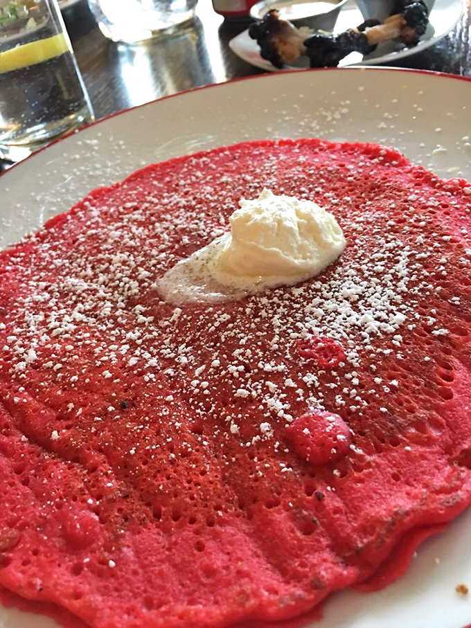 Red velvet pancakes that look like they were designed by a color-obsessed pastry genius. That cloud of whipped cream is just begging to be swirled into the vibrant batter.