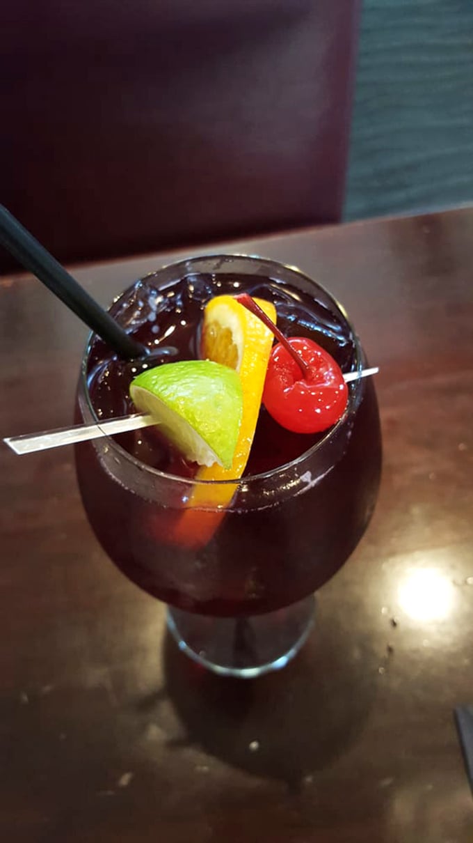 Not just a sangria, but a sunset in a glass. Those fruit garnishes aren't decoration&mdash;they're soaking up deliciousness for your finale.