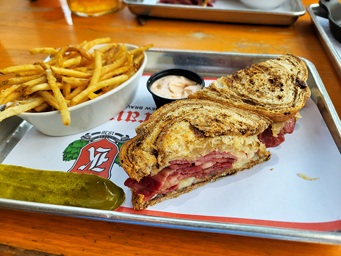 That Reuben isn't just a sandwich&mdash;it's a skyscraper of flavor with corned beef foundations so sturdy you could build a German village on it.