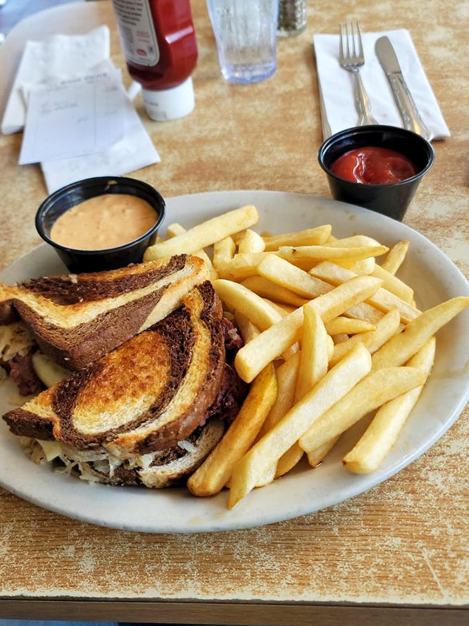 The Reuben sandwich arrives like a monument to Midwest sandwich craftsmanship&mdash;golden, crispy bread barely containing its treasures within.