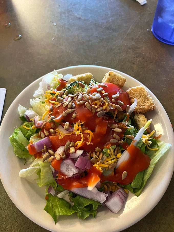 Even the salad shows Midwestern generosity&mdash;fresh greens topped with shredded cheese, sunflower seeds, and enough dressing to make vegetables worth eating.