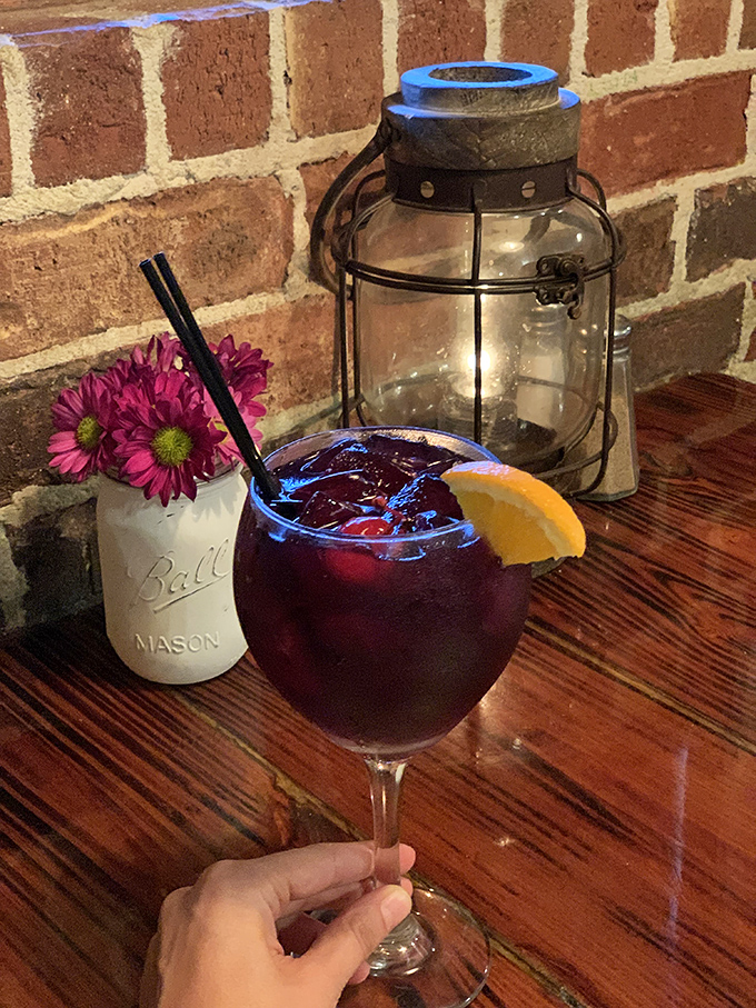 A sangria this ruby-red isn't just a drink, it's a sunset in a glass. That mason jar of flowers says "fancy enough to impress, casual enough to relax."