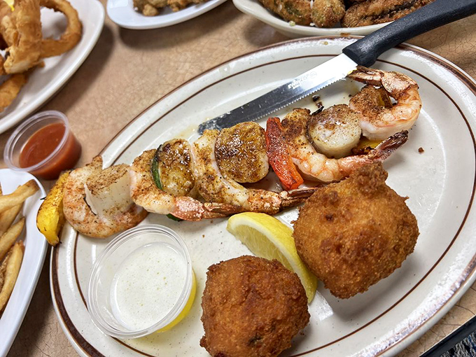 A skewer of seafood treasures alongside hush puppies&mdash;like ocean jewels on a stick that somehow found their way to Tulsa.