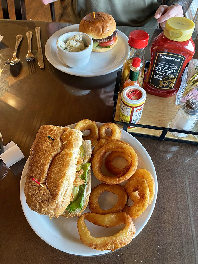 A sandwich and onion rings that would make even the most dedicated health enthusiast temporarily abandon their principles. Worth every calorie.
