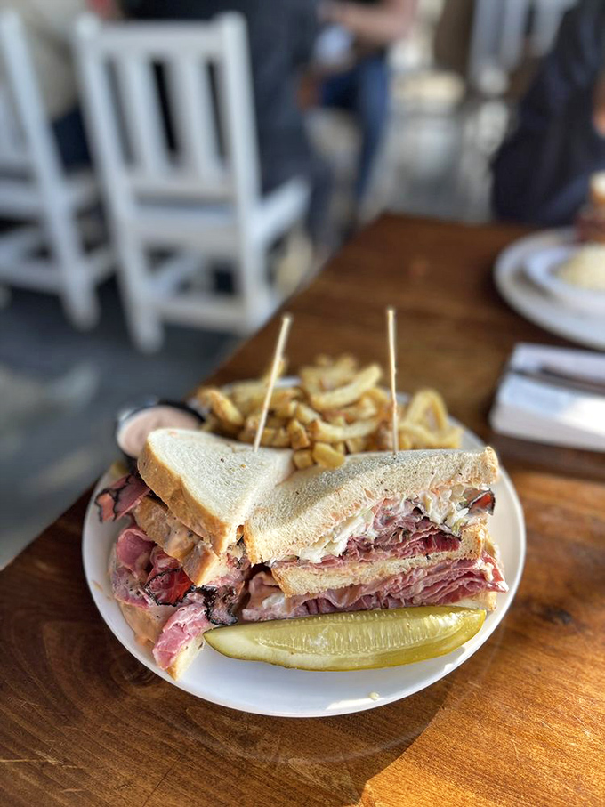 Behold the sandwich that requires a strategy meeting before eating. Those layers of meat aren't just stacked&mdash;they're architecturally sound.