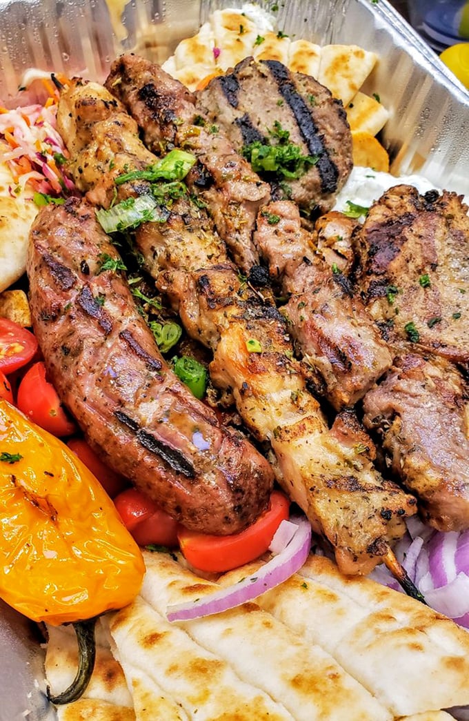 The Small Mix Greek Grill arrives like a carnivore's dream team&mdash;where yeero, souvlaki, and sausage compete for your attention but ultimately play beautifully together.