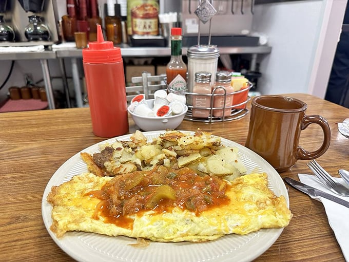 This Spanish omelet brings more heat than a flamenco dancer, draped in sauce that's been simmering since before your alarm went off.