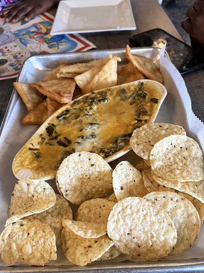 This isn't just spinach dip&mdash;it's a creamy, cheesy celebration served with enough chips to ensure no delicious bite goes unaccompanied.