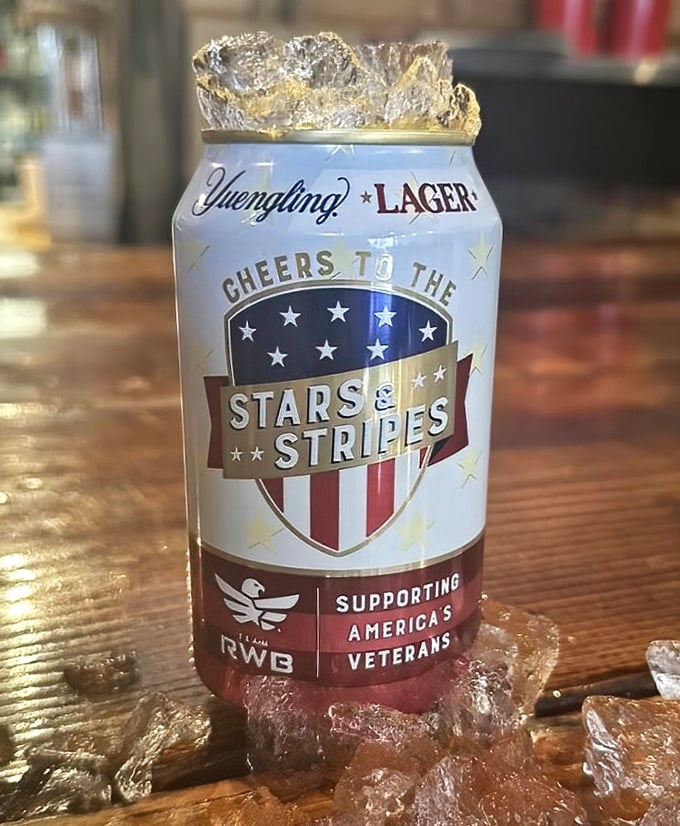 Nothing says "American barbecue experience" quite like an ice-cold beer in patriotic attire. The perfect companion for meat sweats.