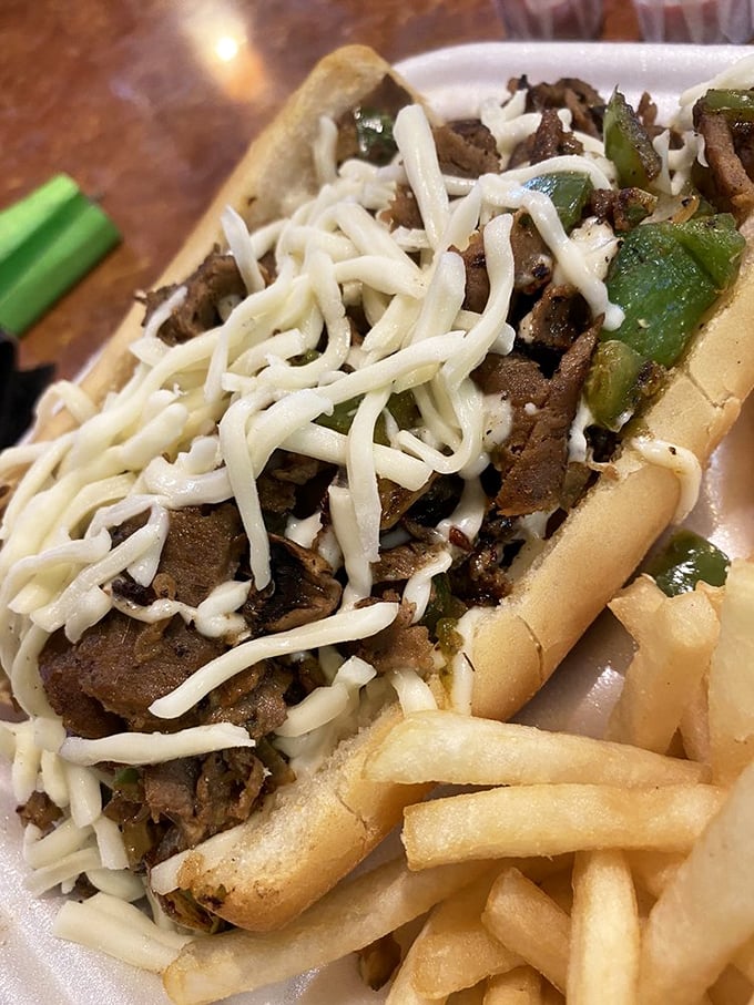 Thinly sliced steak crowned with a blanket of white cheese and green peppers. Comfort food that hugs you from the inside.