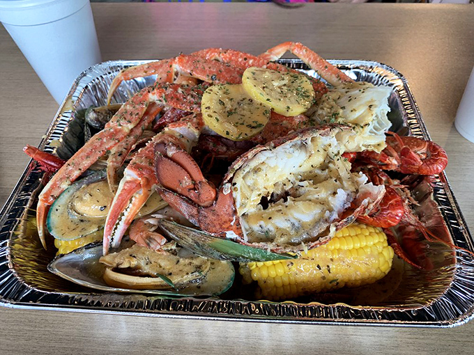 King crab legs stretched out like royal scepters alongside potatoes and corn &ndash; a feast worthy of maritime royalty.