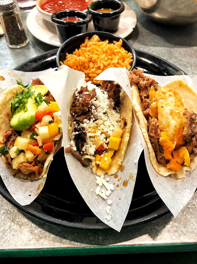 Three amigos on a blue plate, each with its own personality. That lime wedge isn't just garnish&mdash;it's the conductor of this flavor orchestra.