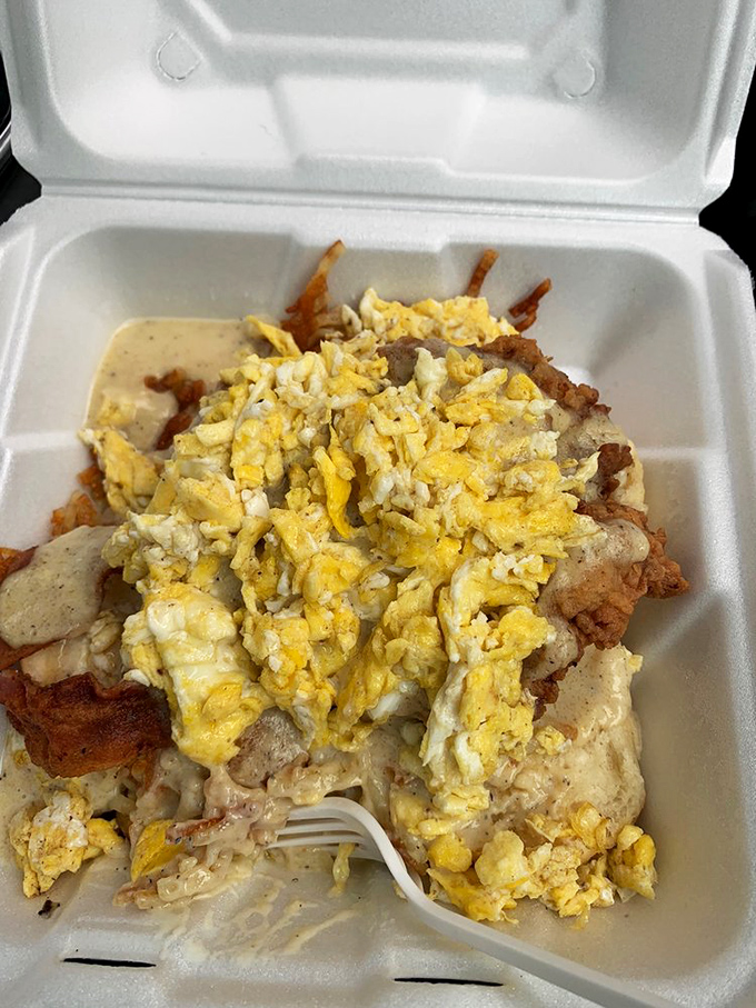 The "everything is bigger in Texas" philosophy applies deliciously here—eggs, hash browns, and chicken fried steak making their foam container home look like Manhattan real estate.