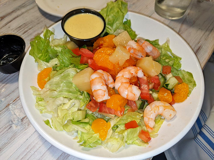 A tropical salad that brings sunshine to your table, regardless of the weather outside. Those shrimp look like they're having fun.