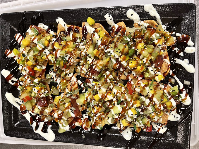 This isn't just nachos&mdash;it's a colorful fiesta of textures and flavors. The artistic drizzles of sauce turn bar food into something worth remembering.