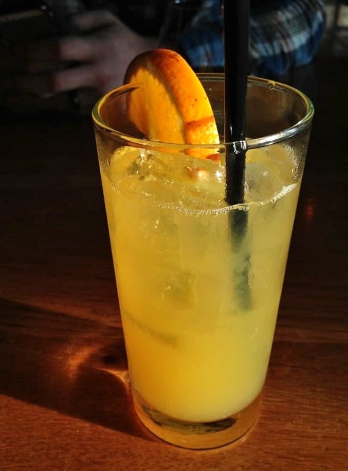 This isn't just a cocktail; it's liquid sunshine in a glass. The perfect palate cleanser between bites of smoky goodness.