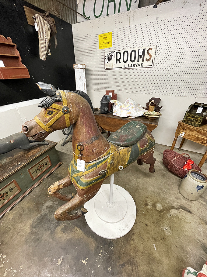 This weathered carousel horse has seen thousands of delighted children come and go, its chipped paint and worn saddle badges of honor from decades of joy.